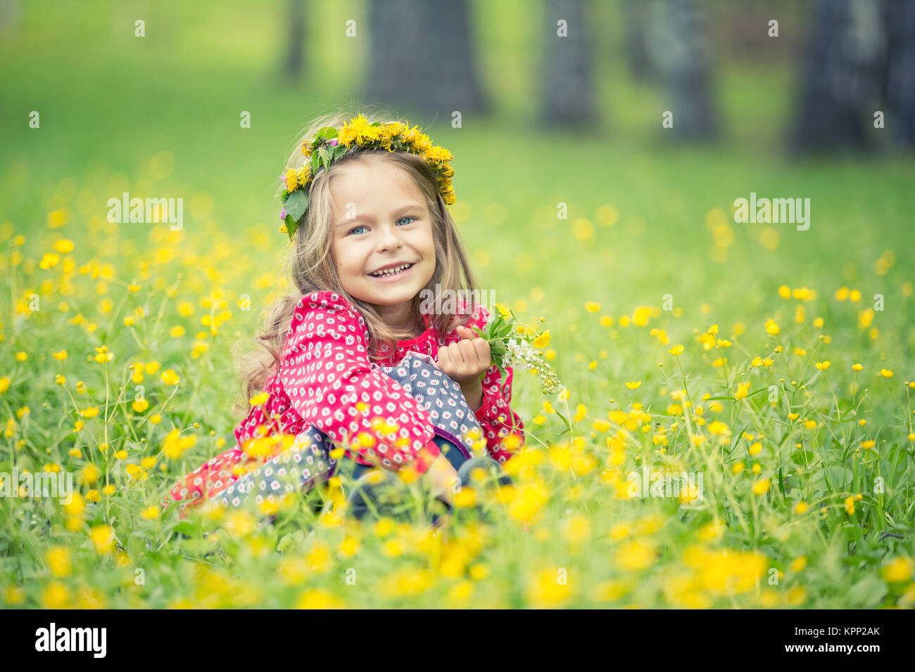 Little girl in spring park Stock Photo - Alamy