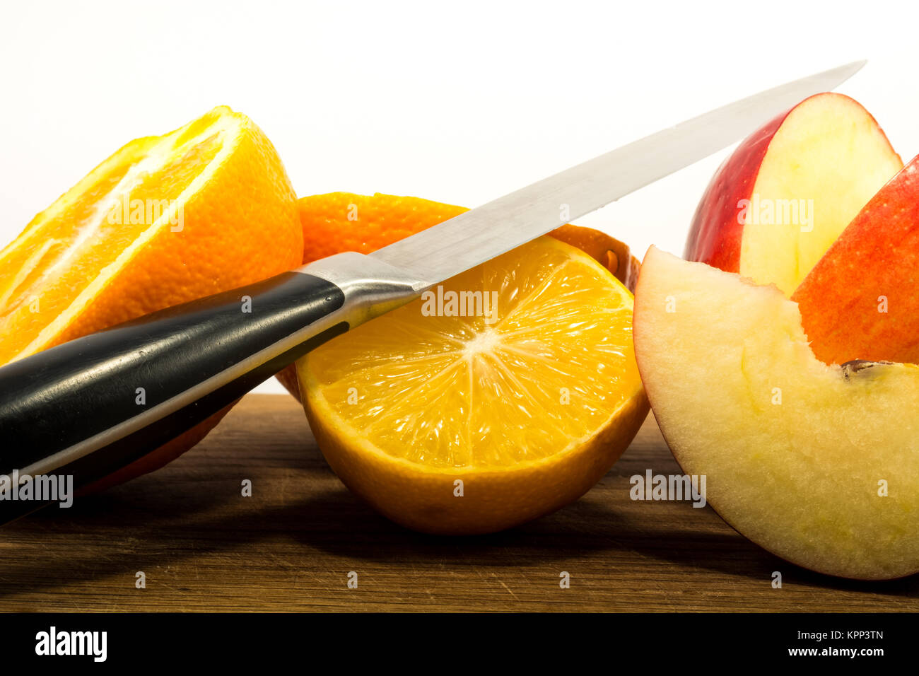 Fruit cutted with knife Stock Photo - Alamy