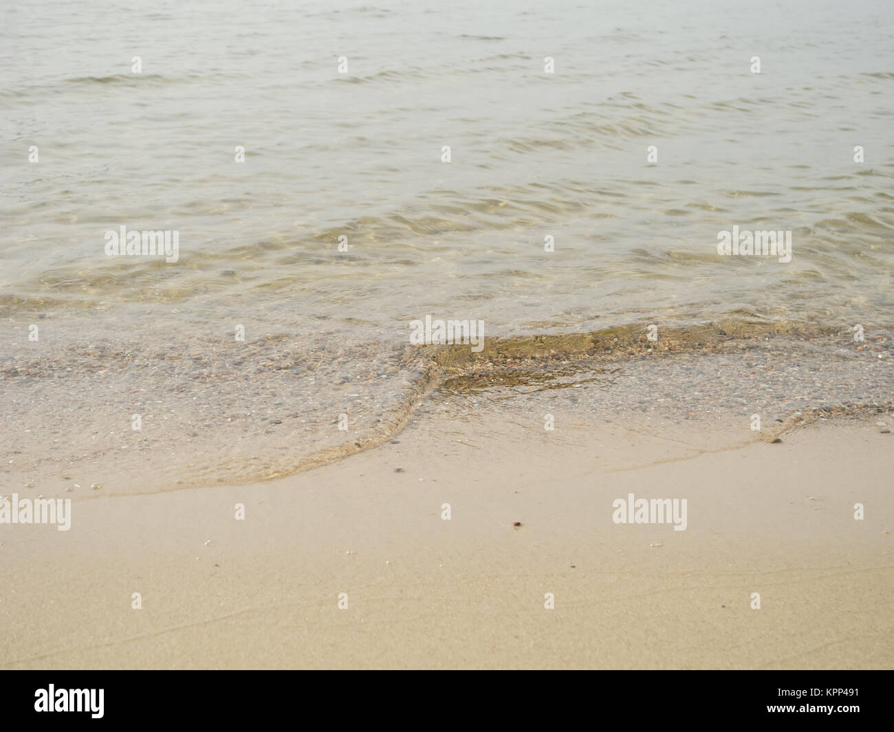 small water waves at the sandy riverside in sunlight Stock Photo - Alamy