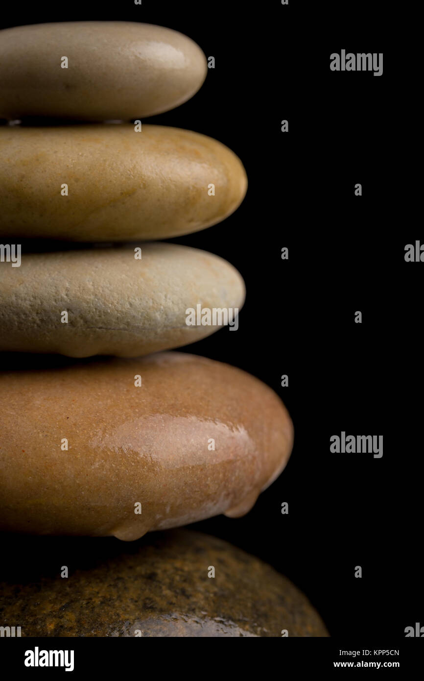 balancing zen stones on black Stock Photo - Alamy