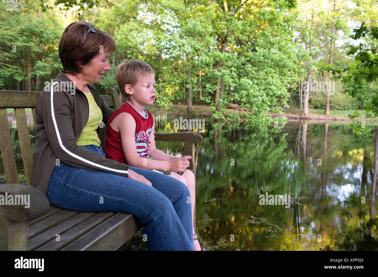 Sitting On A Bench Stock Photo - Alamy