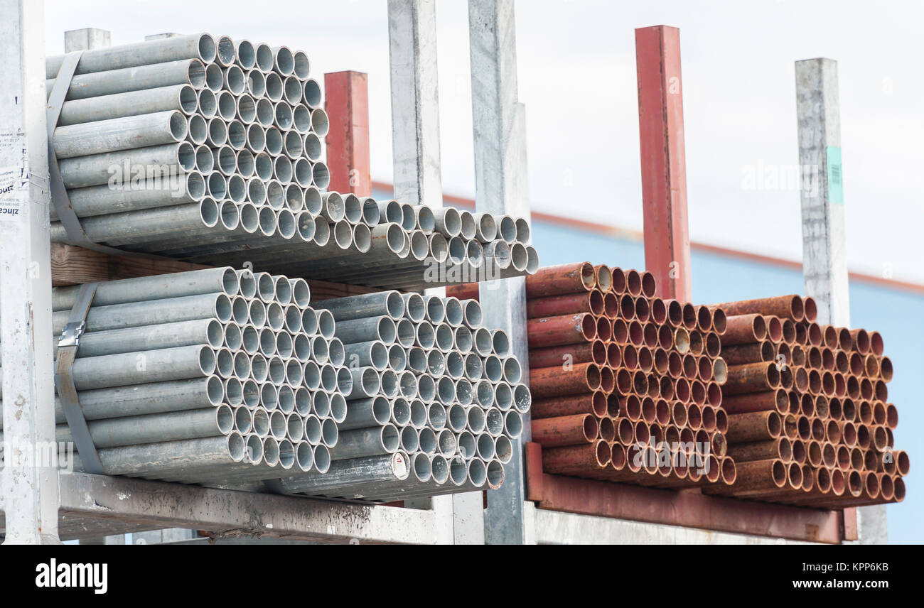 Stack of steel pipes for scaffolding in warehouse Stock Photo - Alamy
