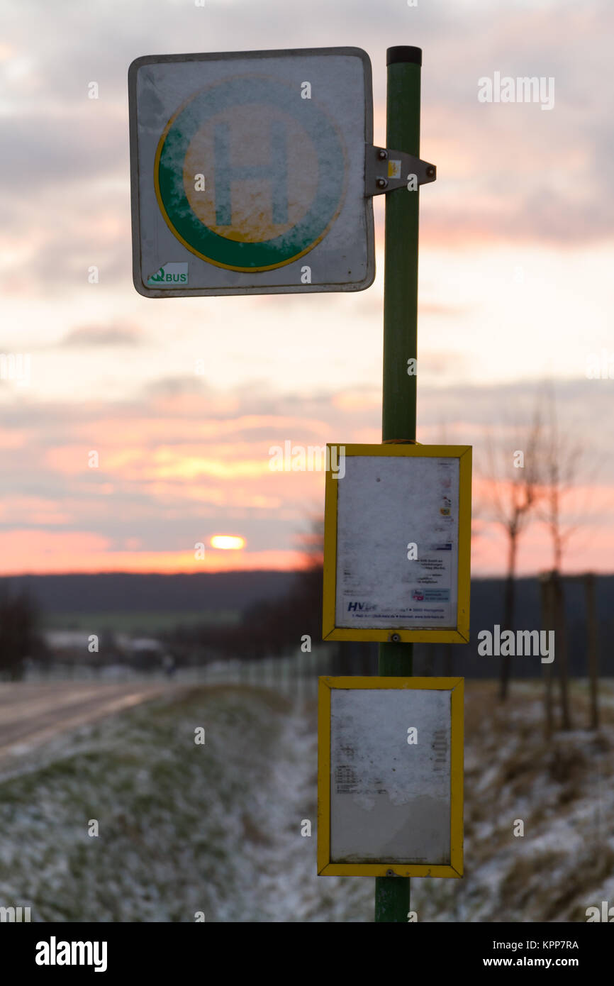 bus stop in winter with sunset Stock Photo - Alamy