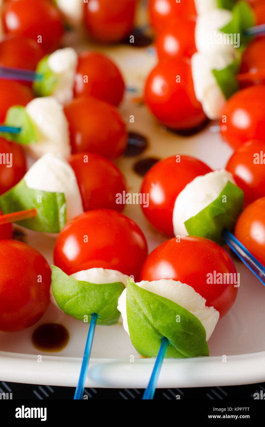 Skewer colored in the Italian flag with tomato, mozzarella and basil ...