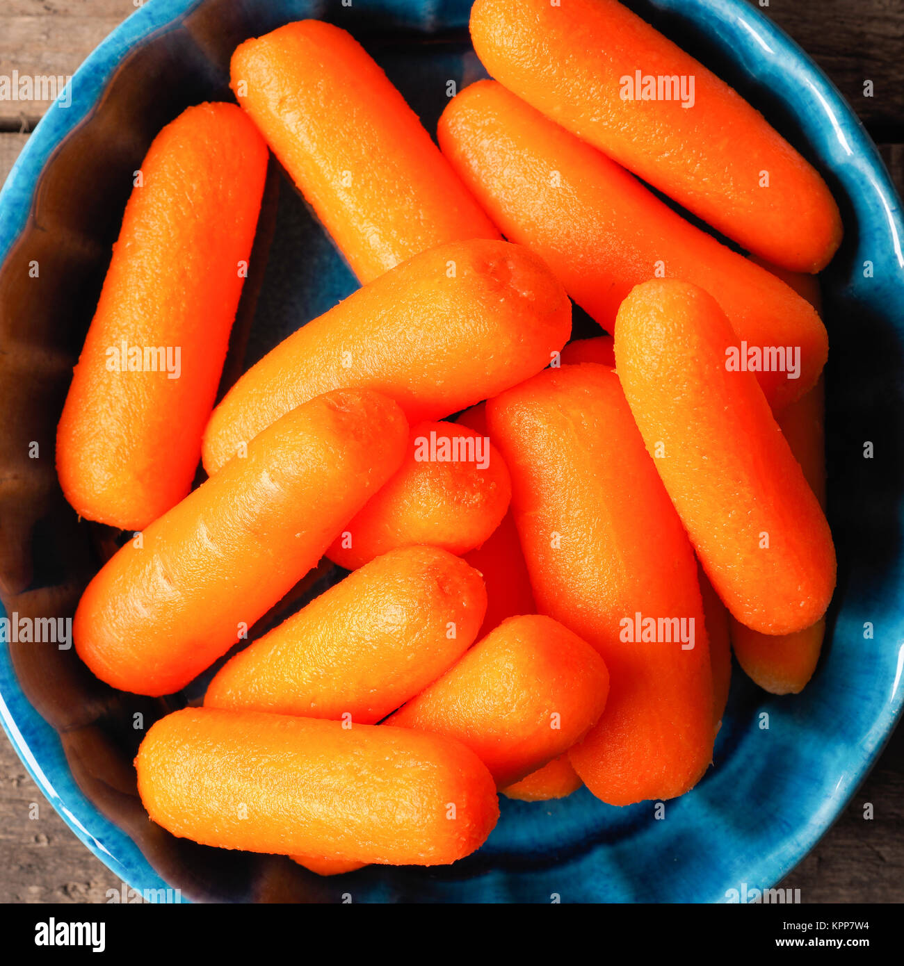 Fresh baby carrots Stock Photo - Alamy
