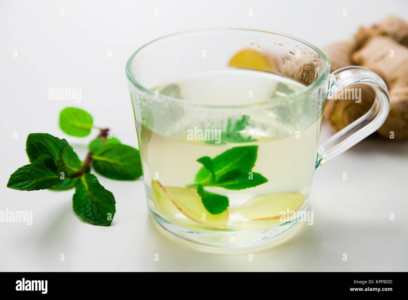 Ginger mint tea on white background Stock Photo - Alamy