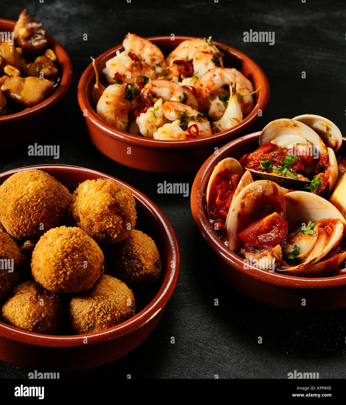 Traditional Spanish fried seafood and tapas appetizers in separate ...