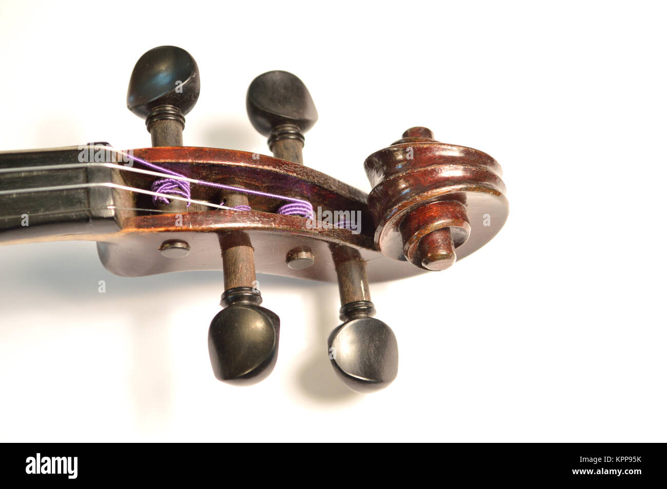 Antique violin scroll against white Stock Photo - Alamy