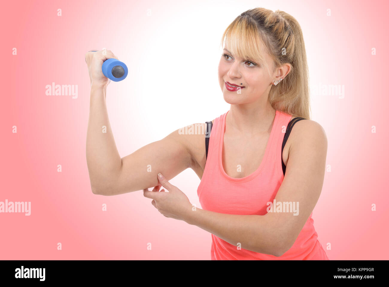 portrait of pretty sporty girl holding weight Stock Photo - Alamy