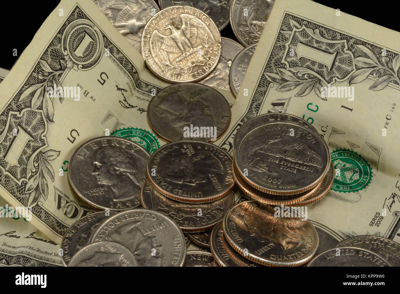 US Money, dollars, dimes, nickels and quarters piled randomly Stock ...