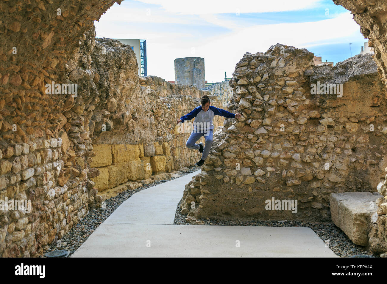 Boy jumping in a ruins Stock Photo - Alamy