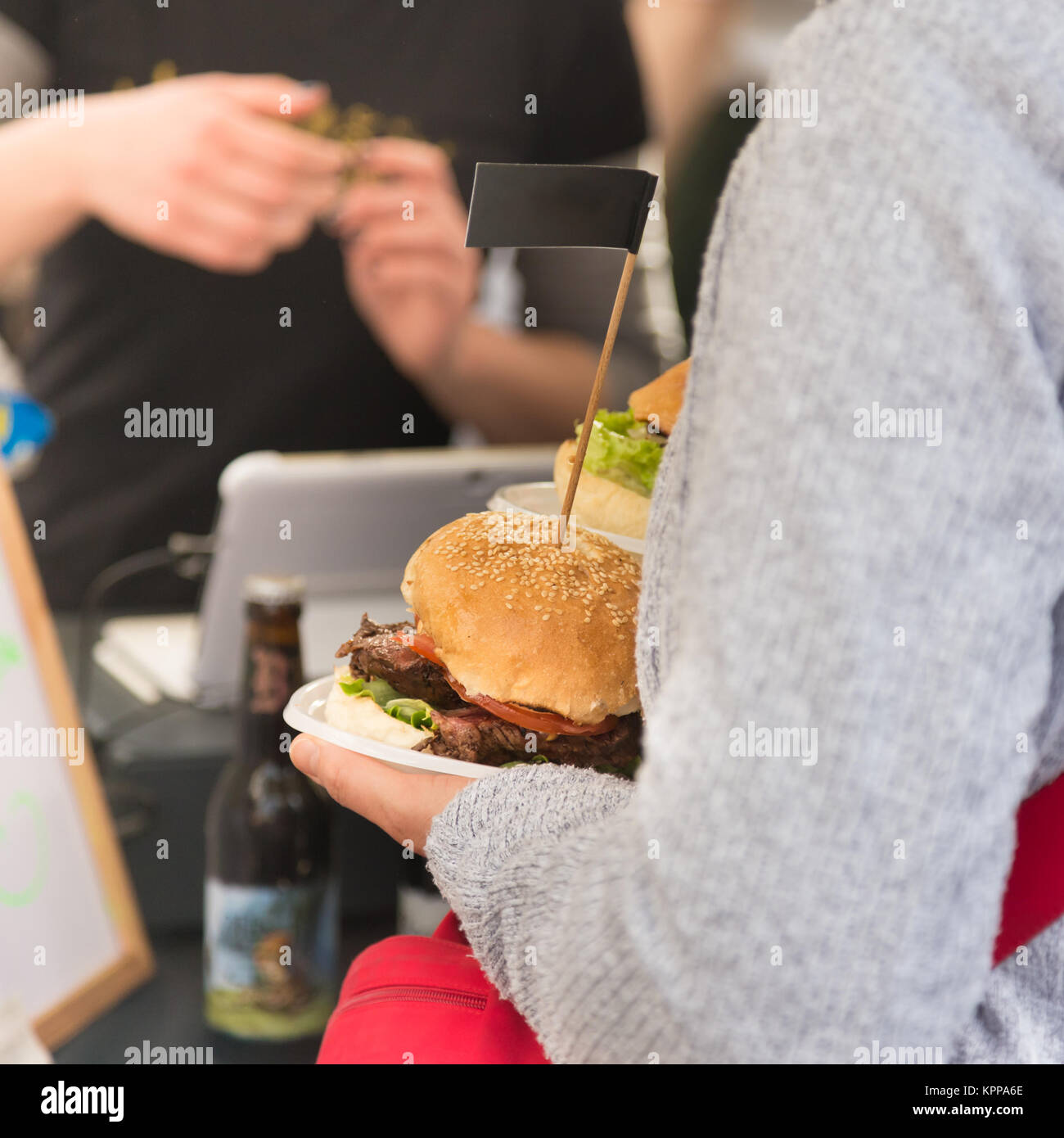 Beef burgers being served on street food stall Stock Photo - Alamy