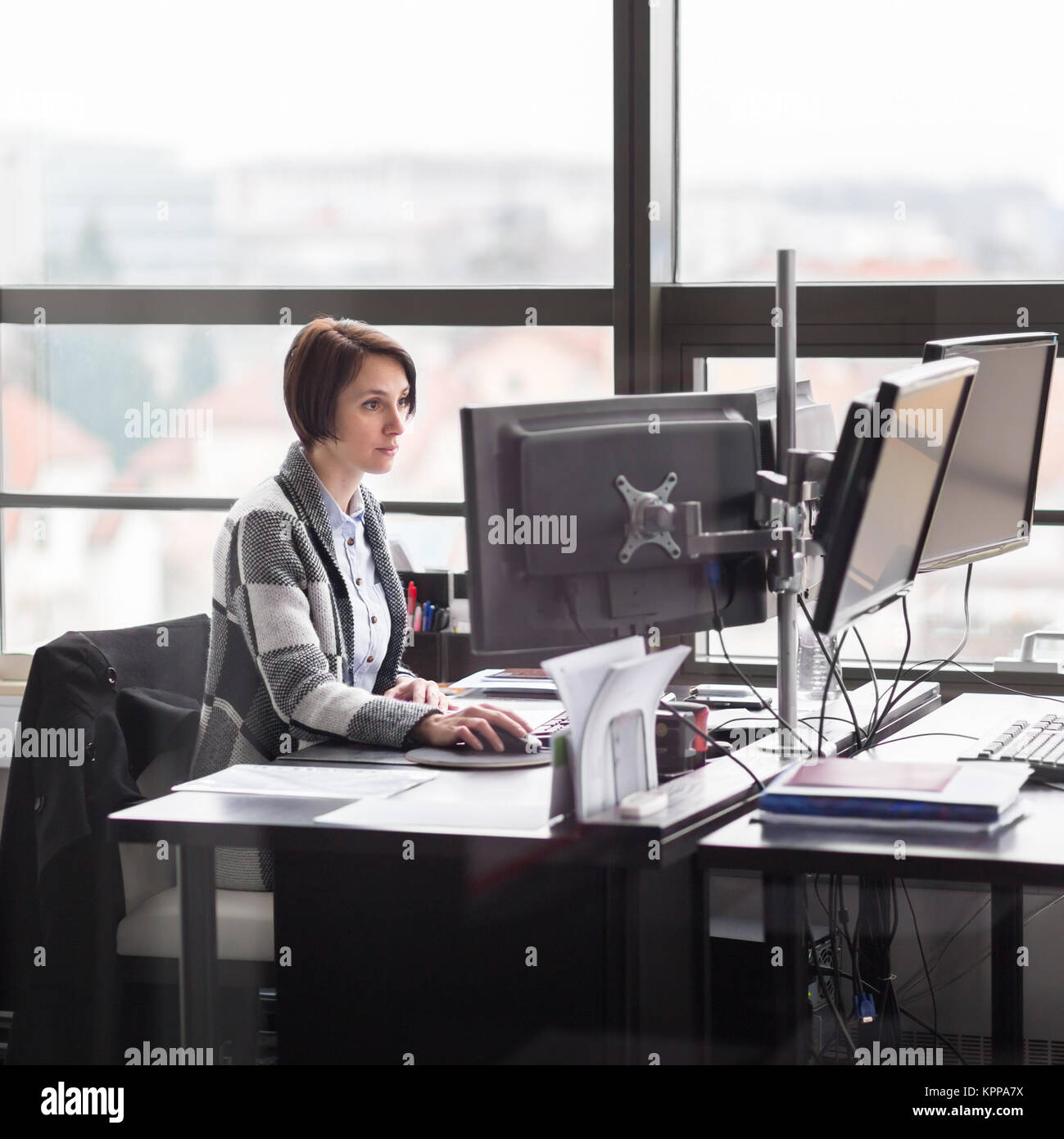 Business woman working in corporate office Stock Photo - Alamy