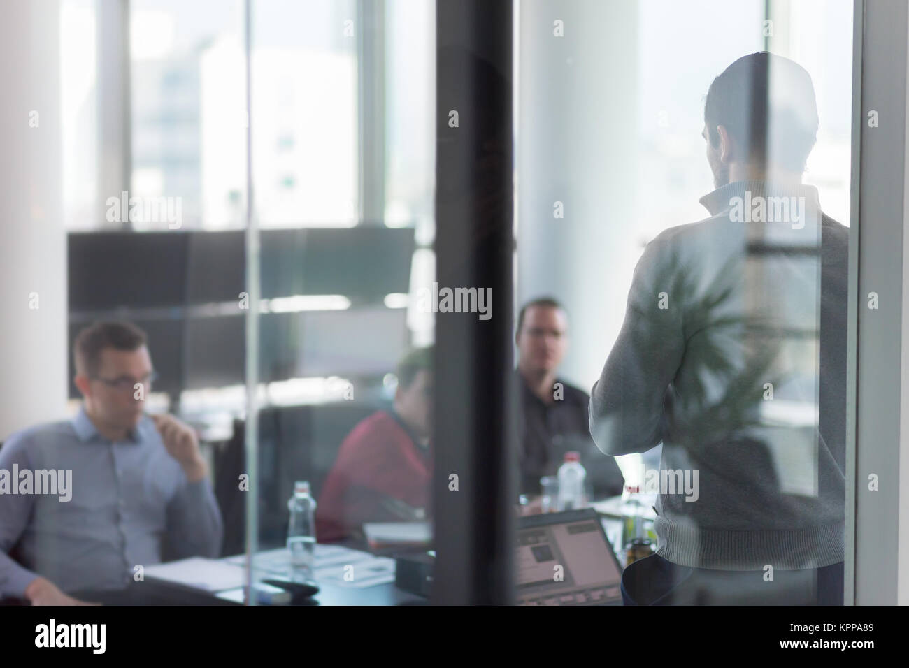 Business team leader delivering presentation in office Stock Photo - Alamy