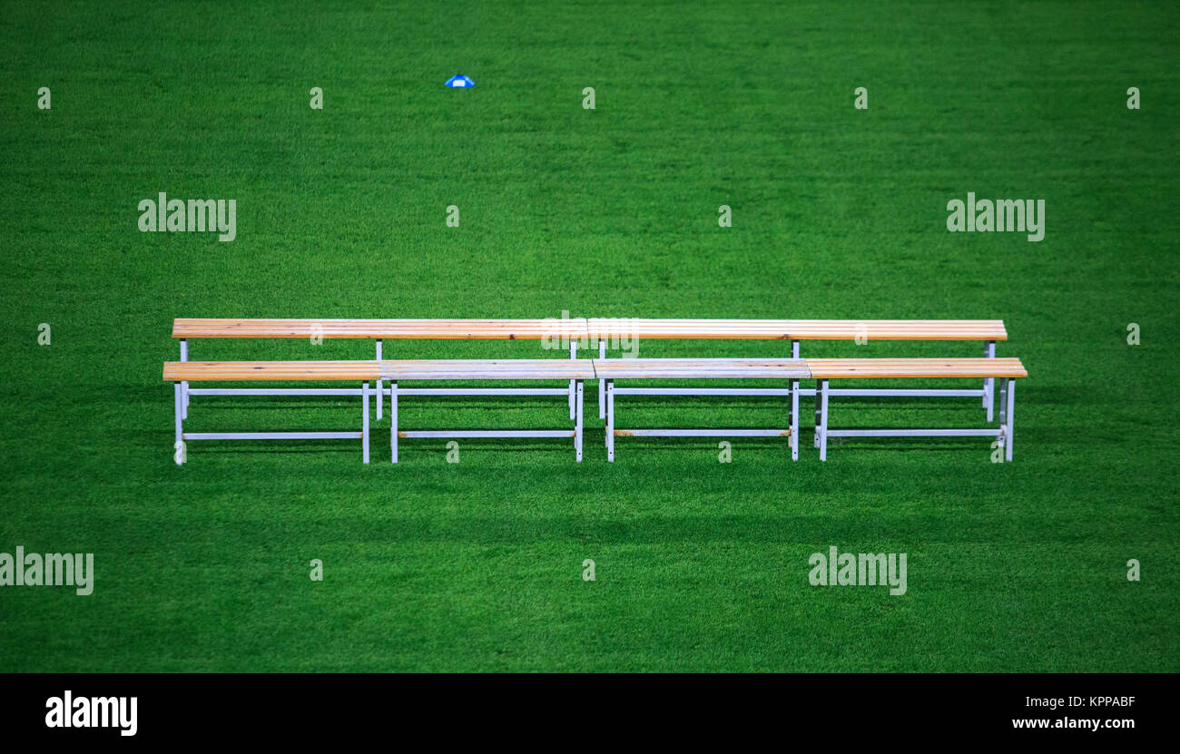 Bench in a soccer stadium Stock Photo - Alamy