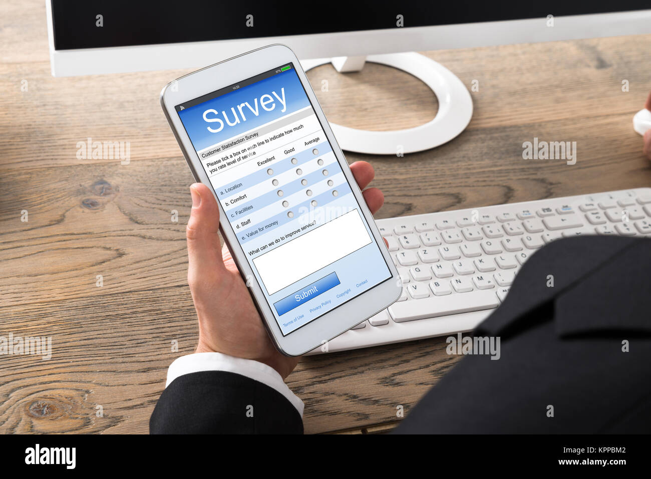 Close-up Of A Businessman Filling Online Survey Form Stock Photo - Alamy