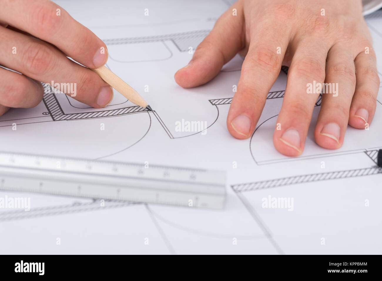 Designer holding blueprint writing on hi-res stock photography and ...