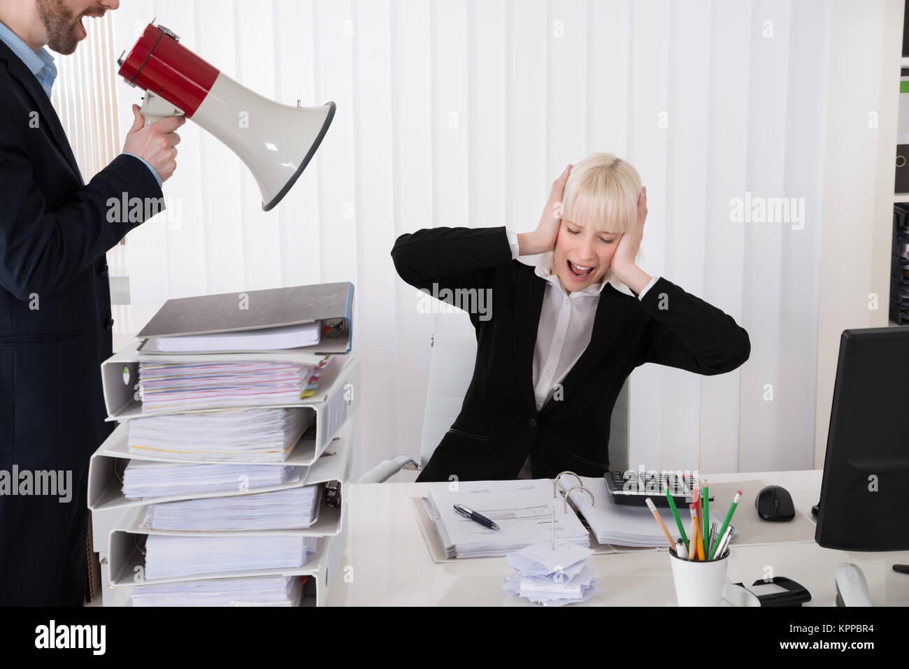 Boss Shouting At Businesswoman Through Loudspeaker Stock Photo - Alamy