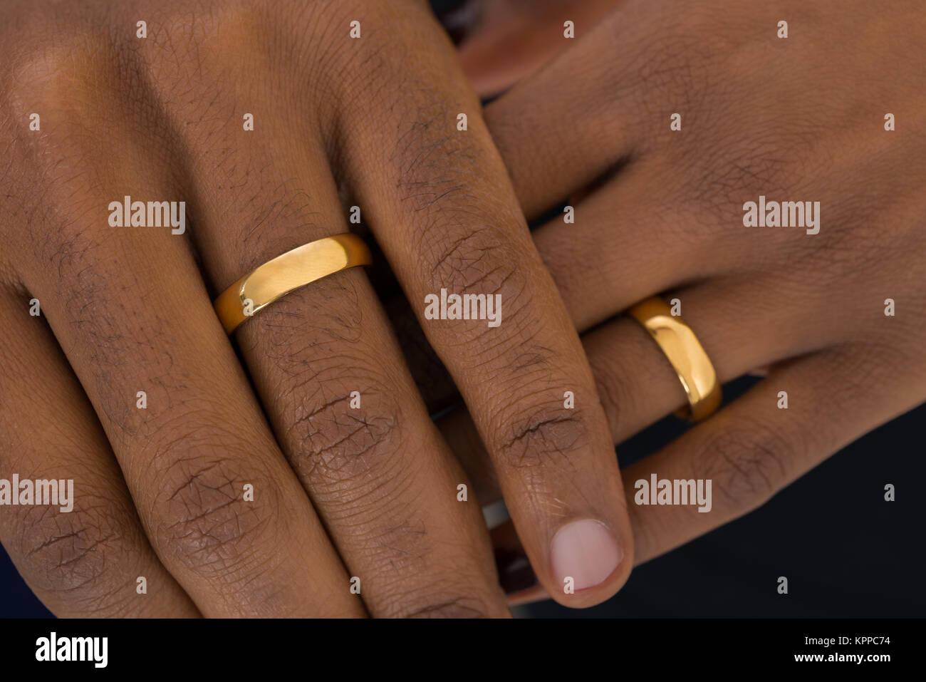 Hands Wearing Golden Rings Stock Photo - Alamy