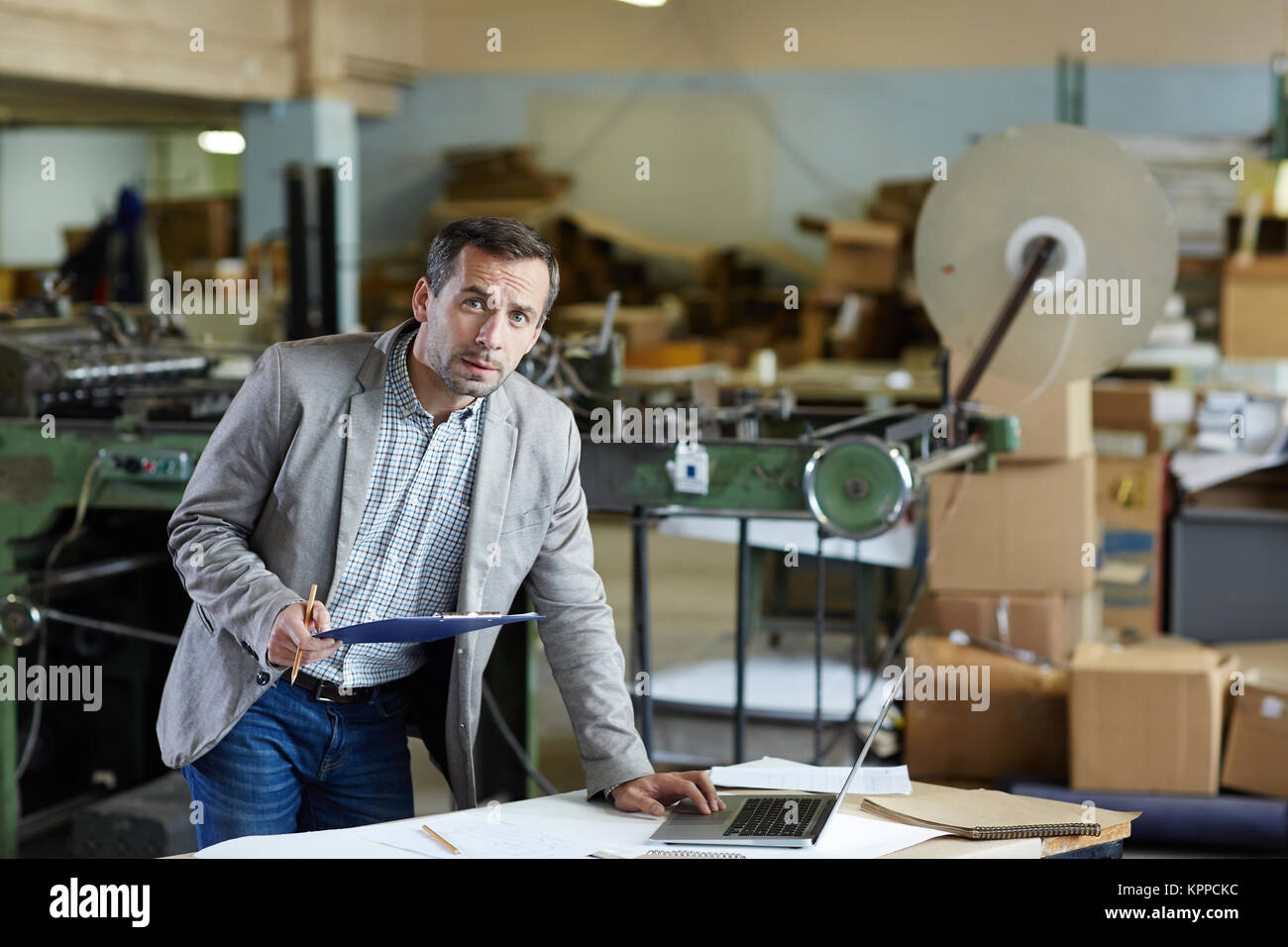 Man working in factory Stock Photo - Alamy