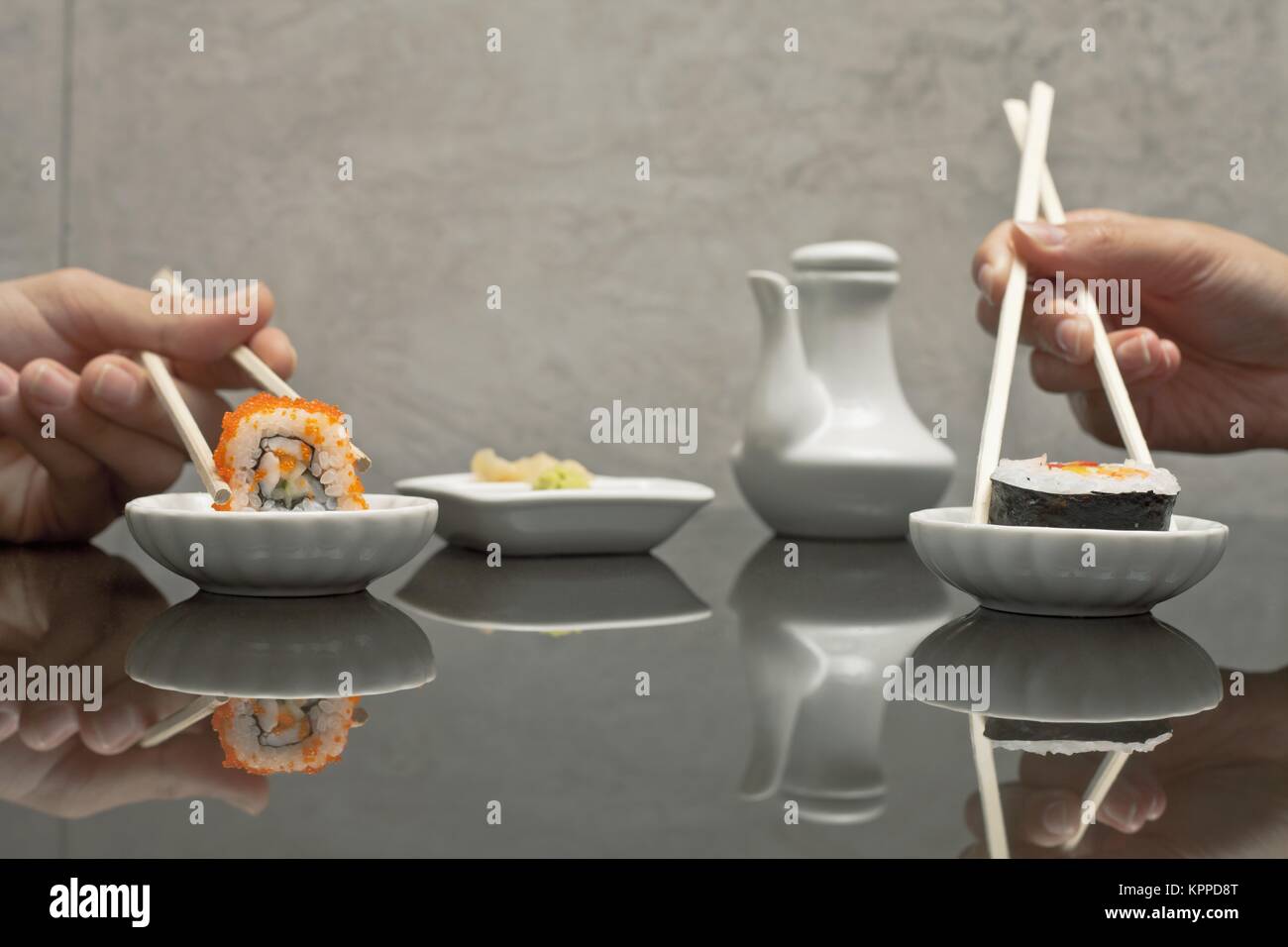 Human hands holding plate sushi hi-res stock photography and images - Alamy
