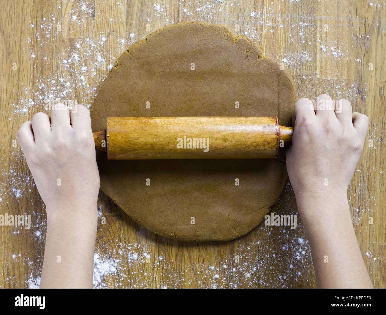 human hand rolling gingerbread dough Stock Photo - Alamy