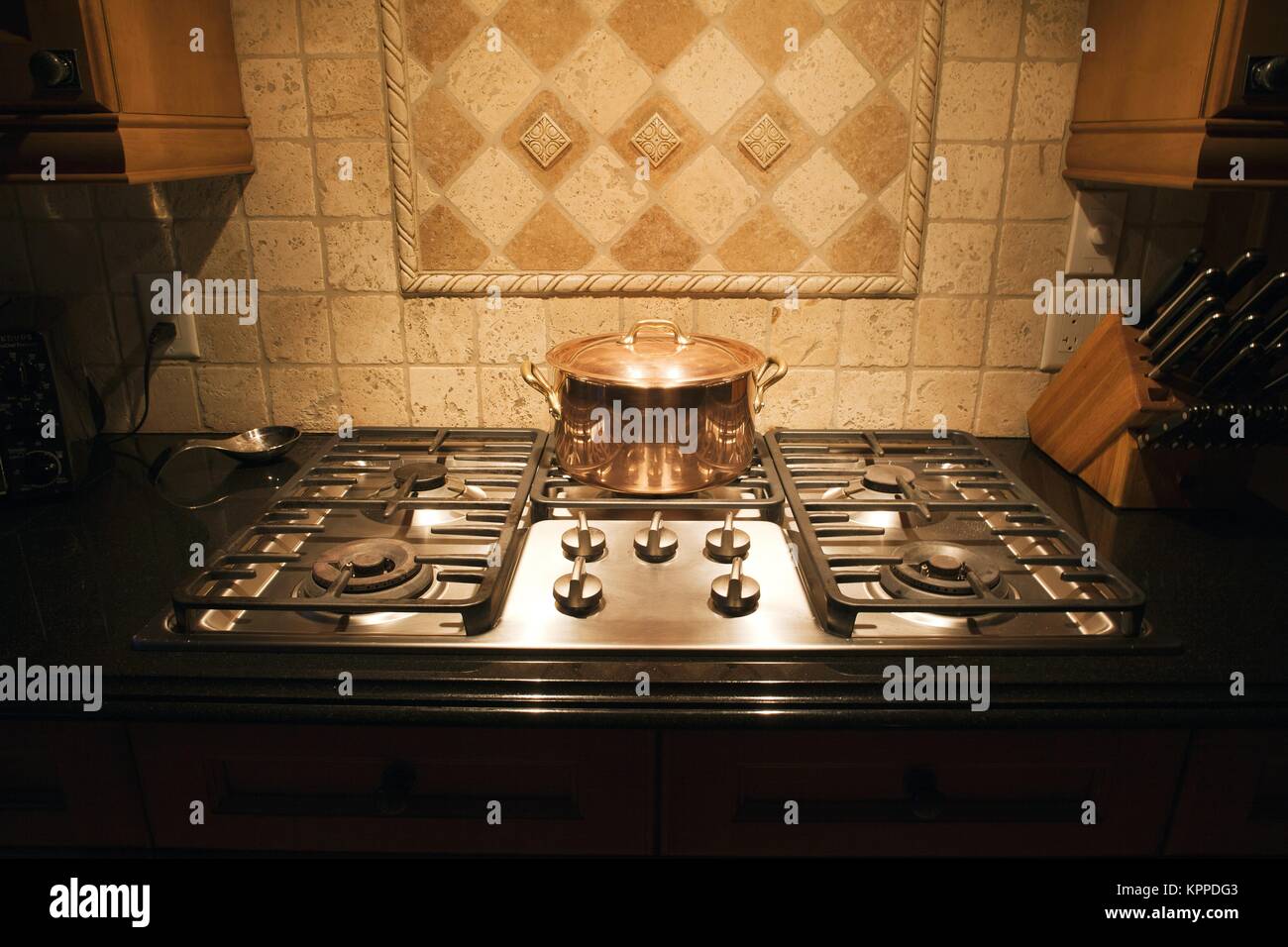 image of a copper utensil on stove Stock Photo - Alamy