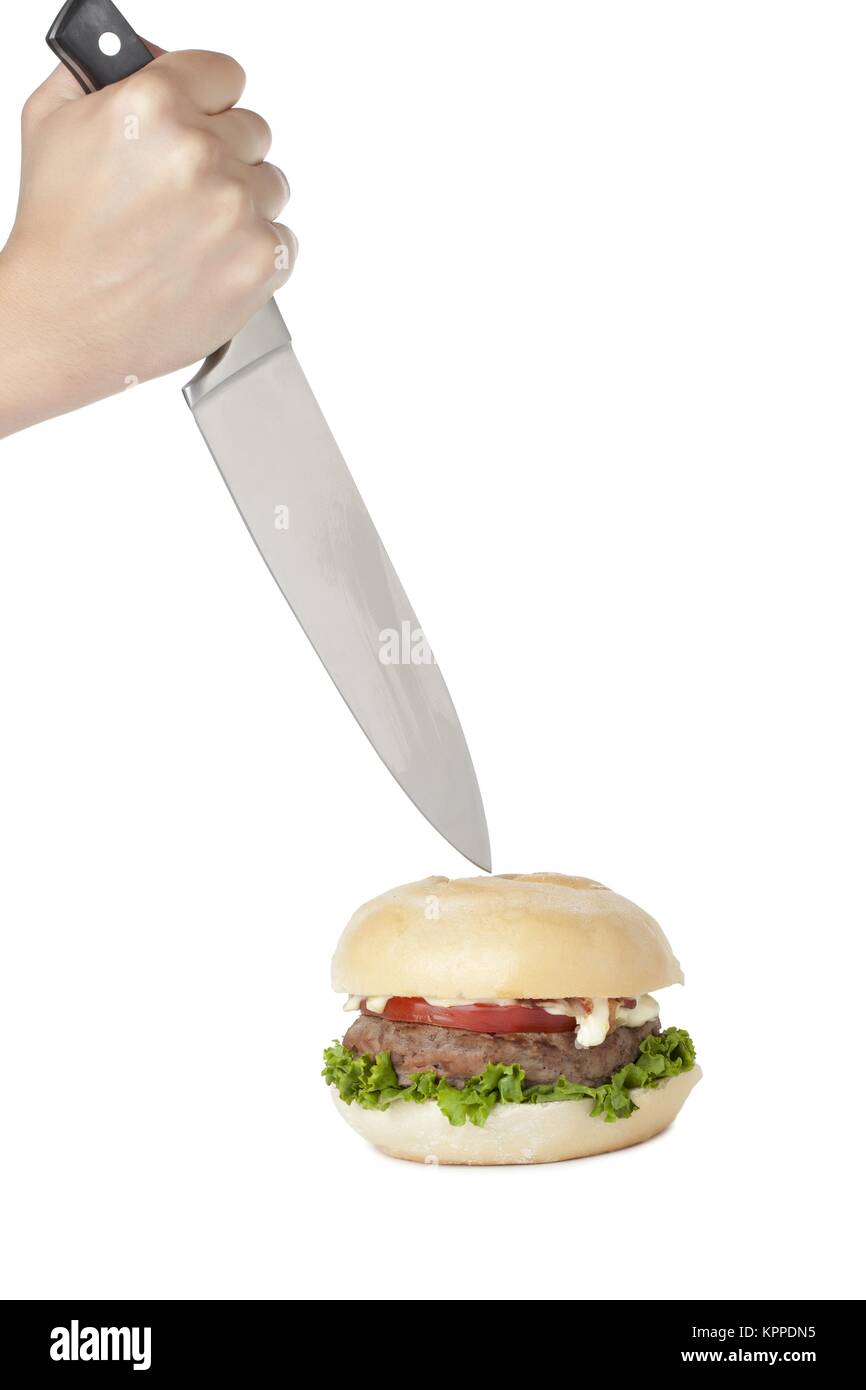 knife about to cut the chicken burger Stock Photo - Alamy