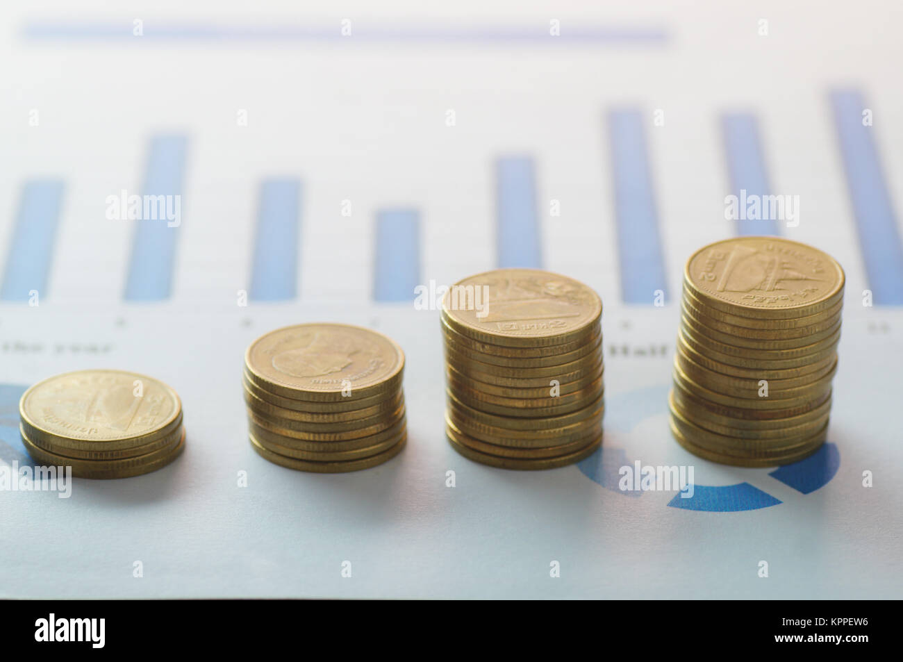 Stacked of money coins with book bank on wood table background and ...