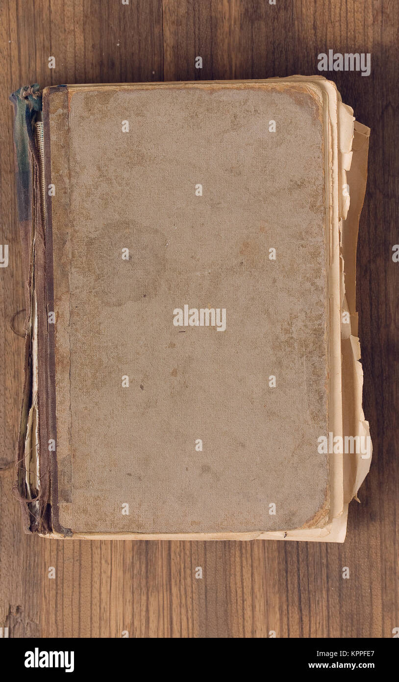 old shabby book with a blank cover lying on a rough board Stock Photo ...