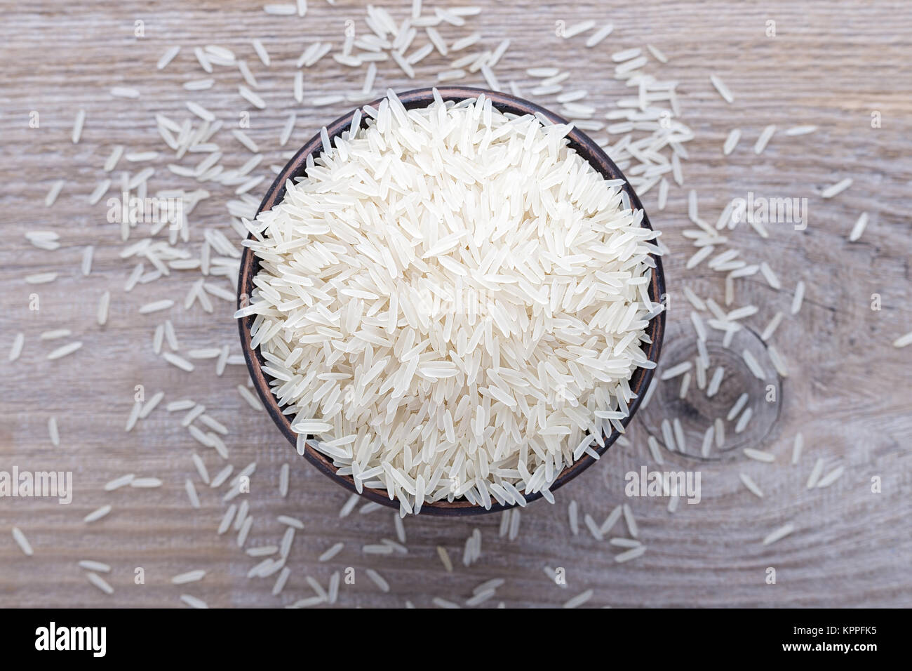 Japanese traditional food, uncooked rice in a bowl on a wooden ...