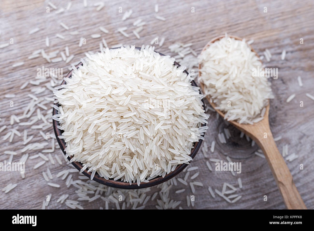 Japanese traditional food, uncooked rice in a bowl on a wooden ...