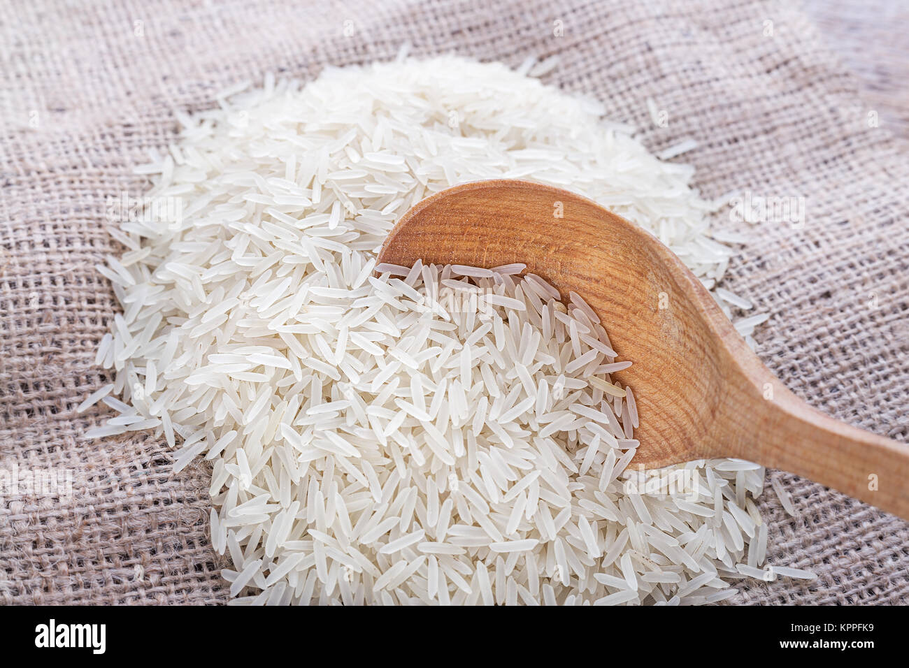 raw rice scattered on the rough surface, top view Stock Photo - Alamy