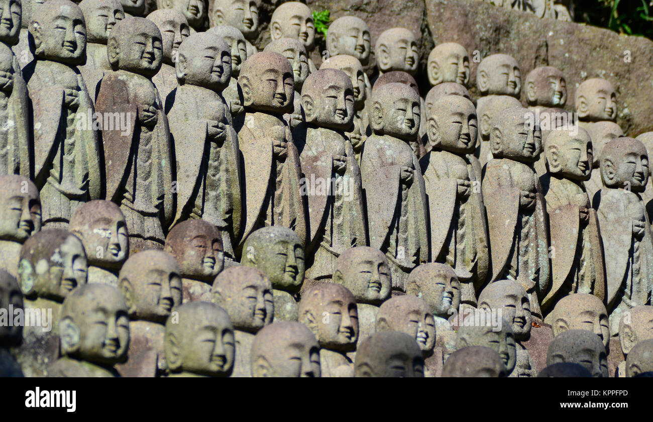 Rows of old buddhist monk traditional small statues in Japan Stock ...