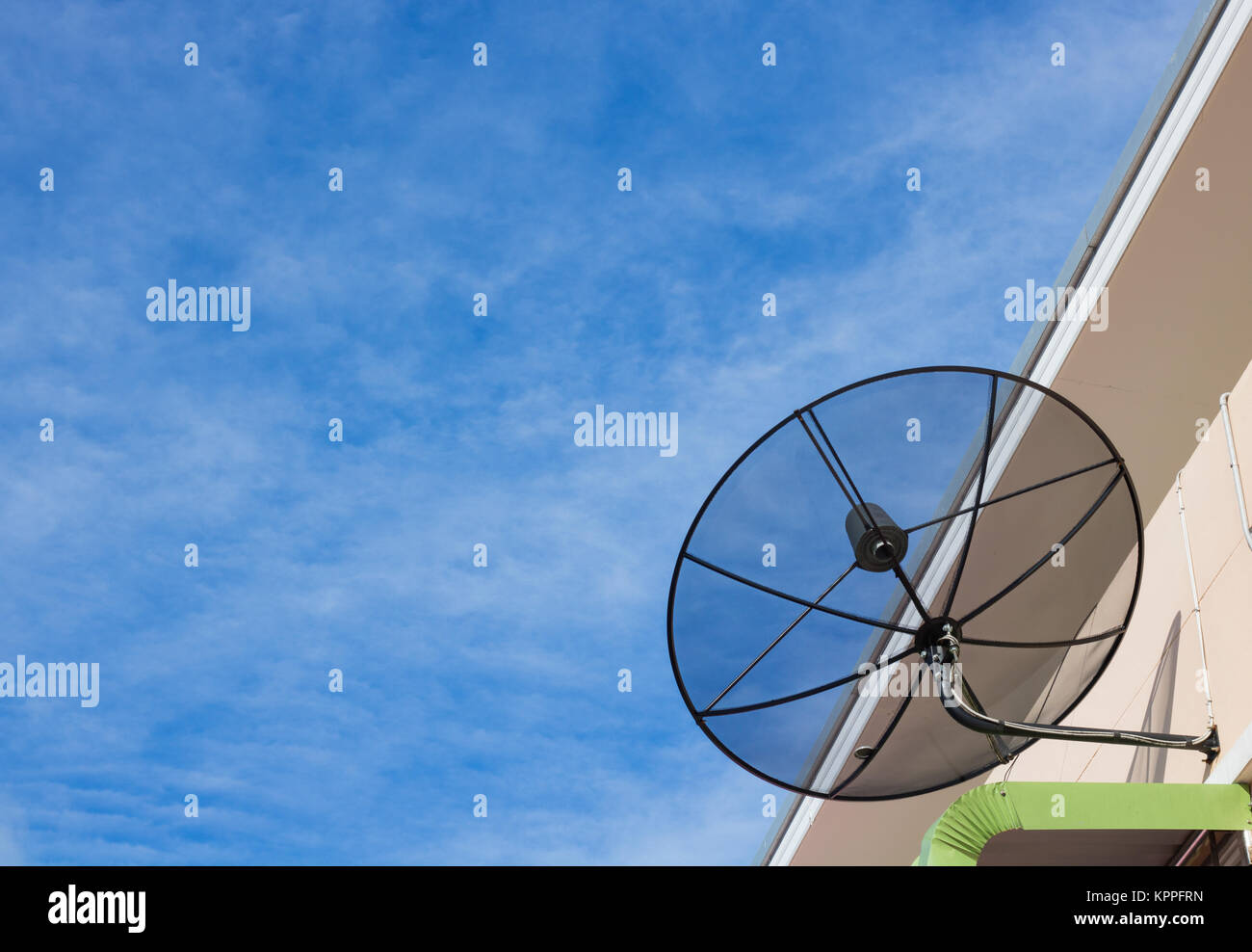 Satellite on building with blue sky Stock Photo - Alamy