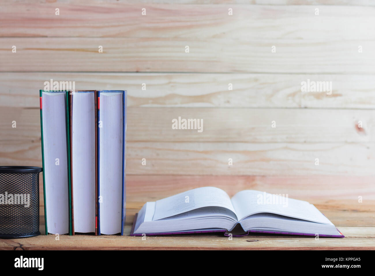 books on desk and wood background Stock Photo - Alamy