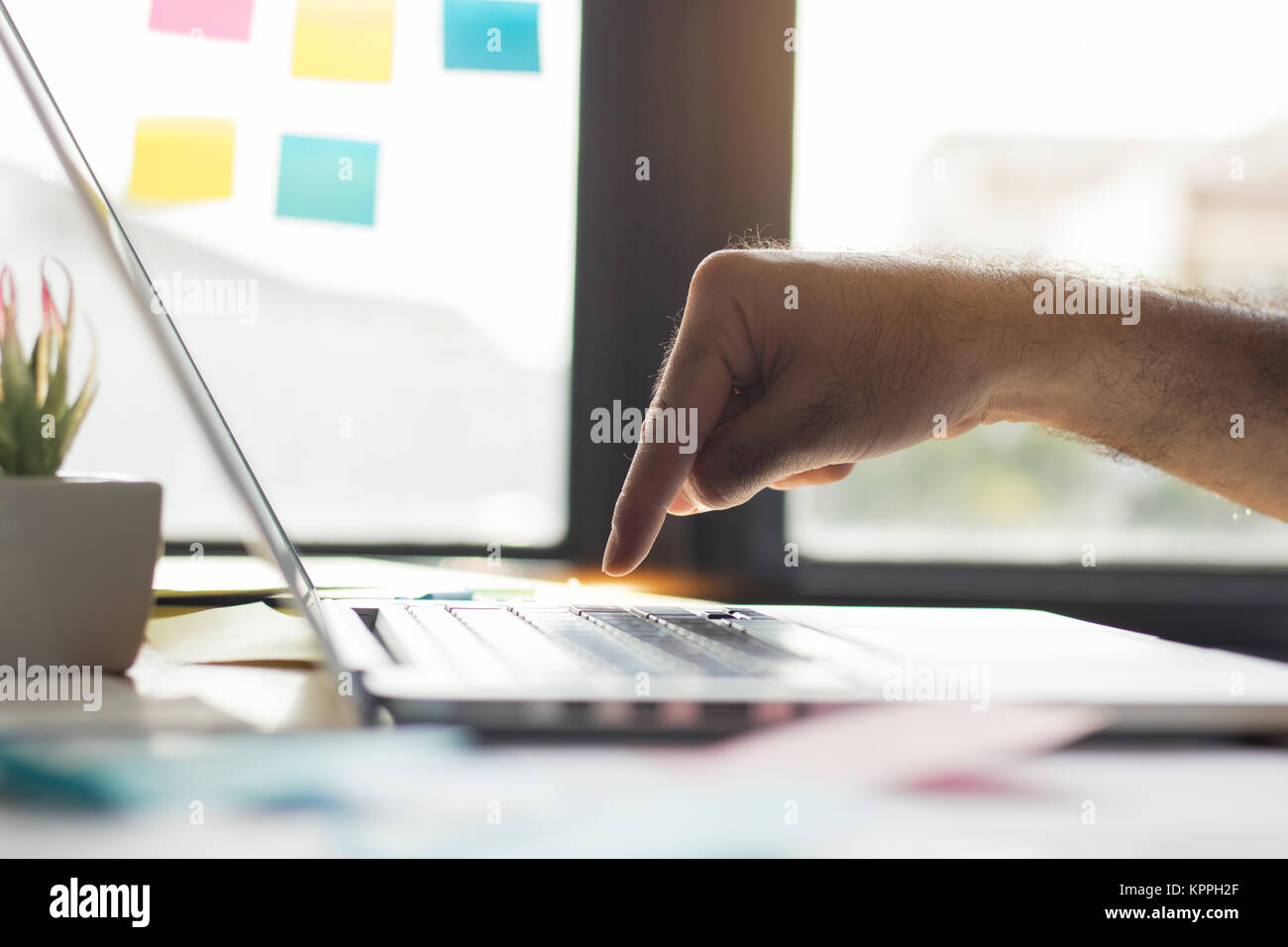 Connection and technology concept, man use finger pressing on laptop in ...