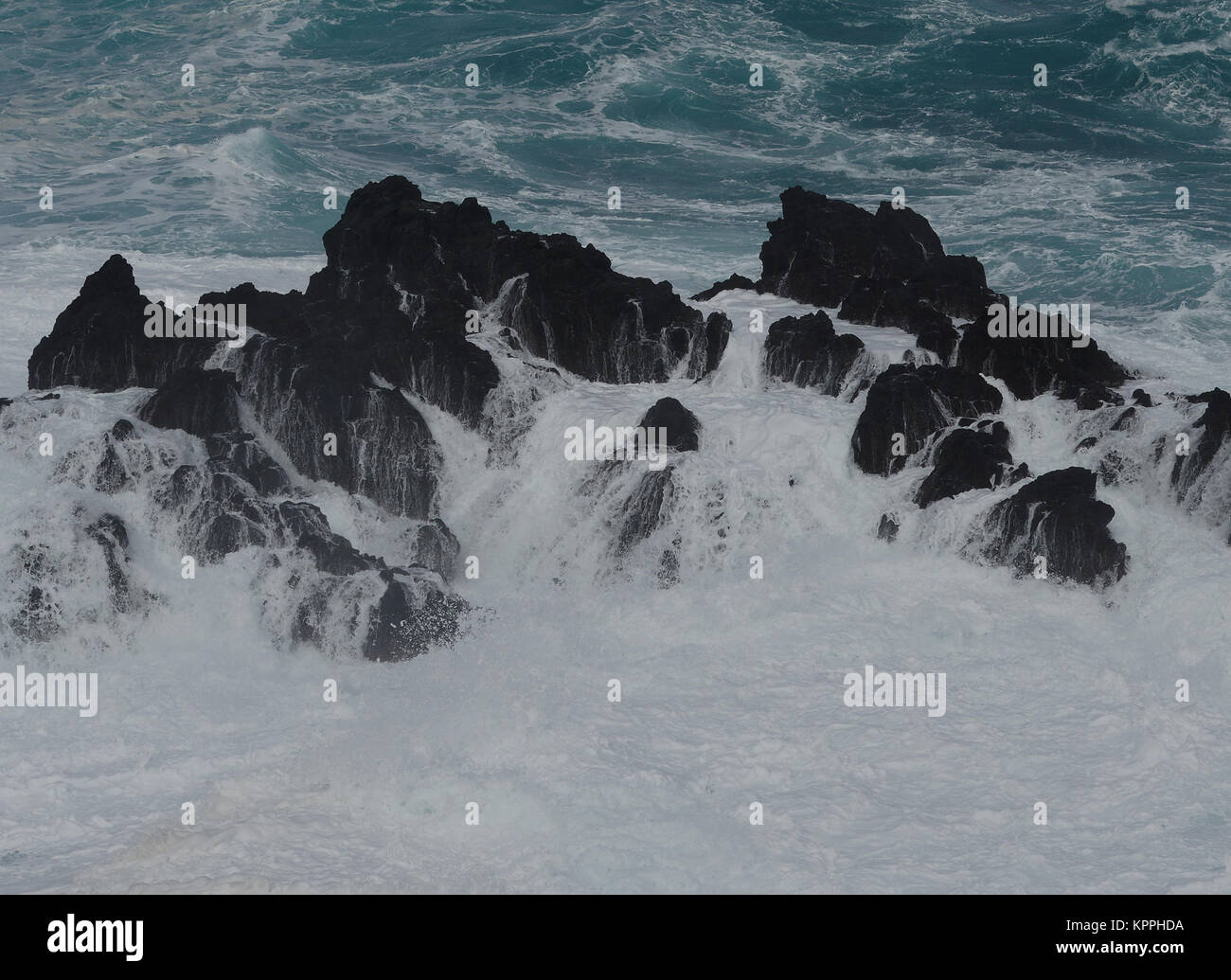 Black rocks in the surf Stock Photo - Alamy