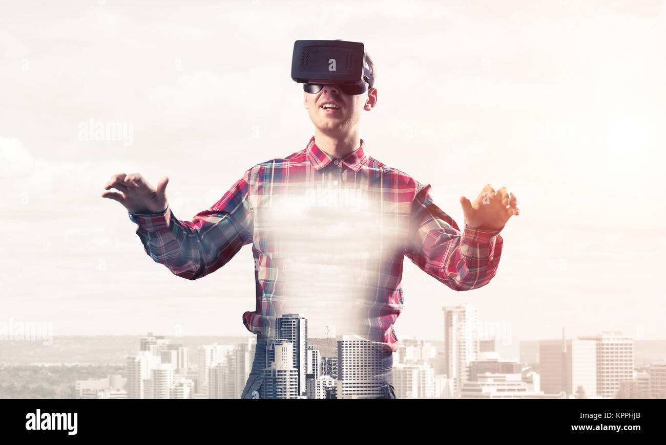 Guy wearing checked shirt and virtual mask stretching hands and Stock ...