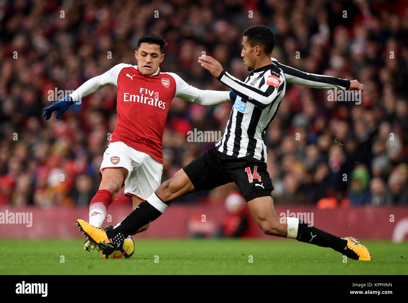 Arsenal's Alexis Sanchez (left) and Newcastle United's Isaac Hayden ...