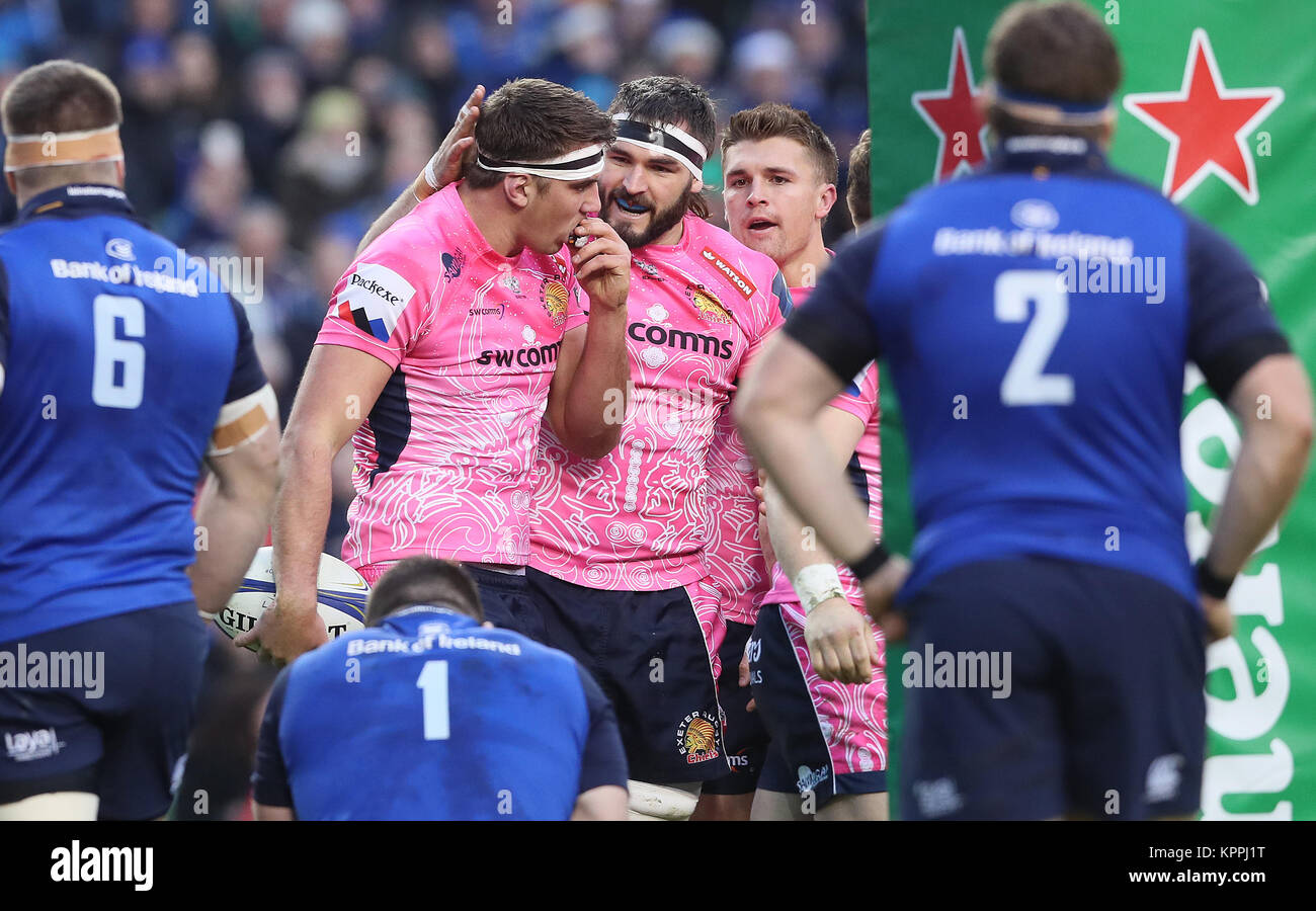 Exeter Chiefs' Sam Skinner (left) after scoring his side's first try ...
