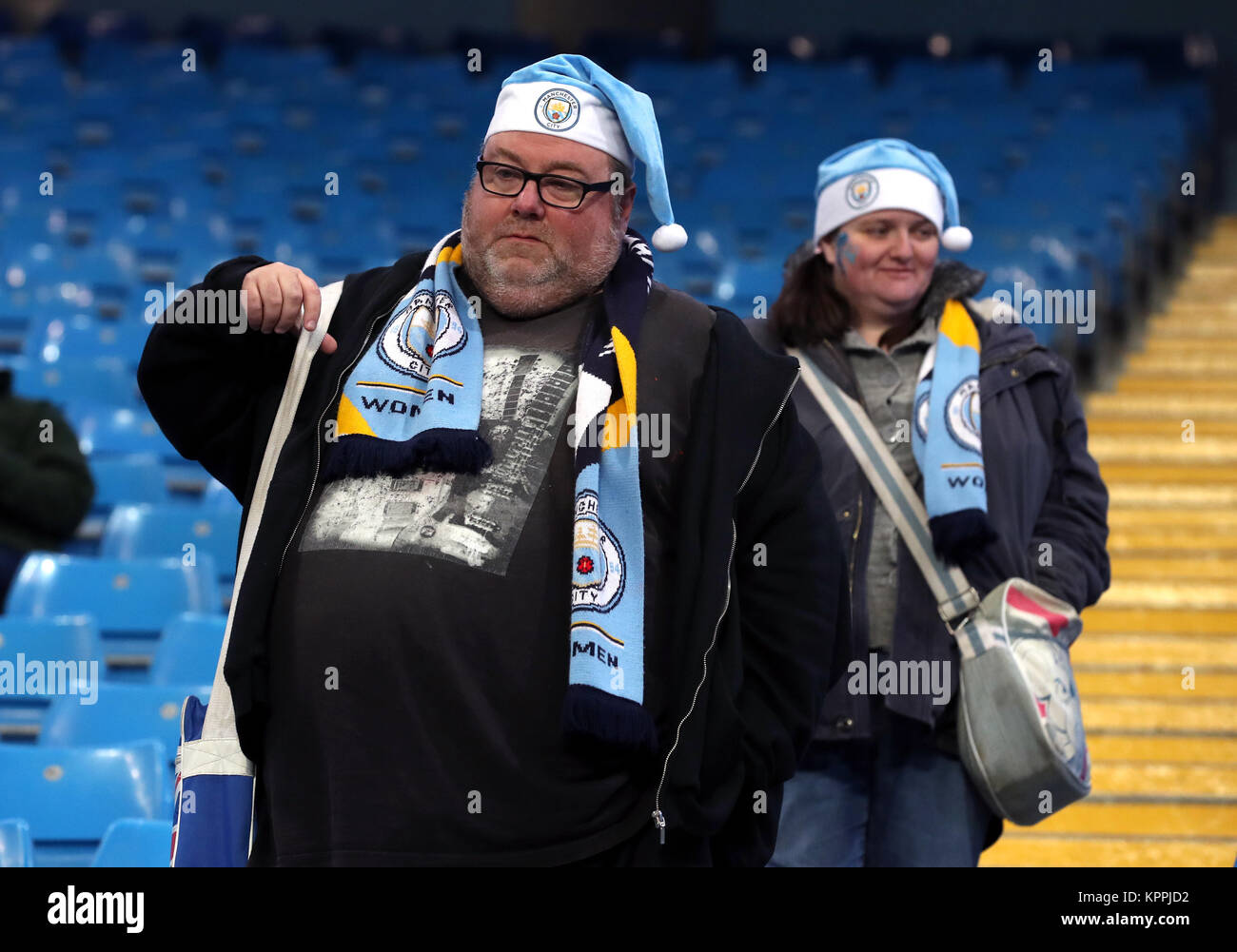 Manchester City fans in the stands wearing santa hats during the ...