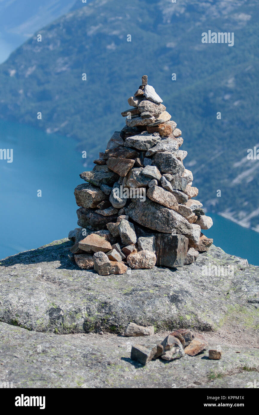 Balanced stack of rock and stones constructions above the Lysefjord at ...