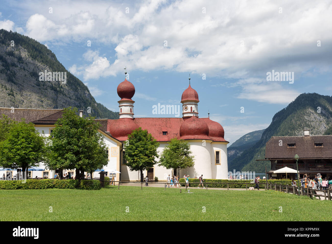 People visiting St. Bartholomew's Church at Konigssee in Germany Stock ...