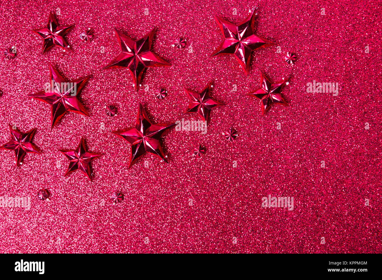 Festive decorations on red shiny background pattern Stock Photo - Alamy
