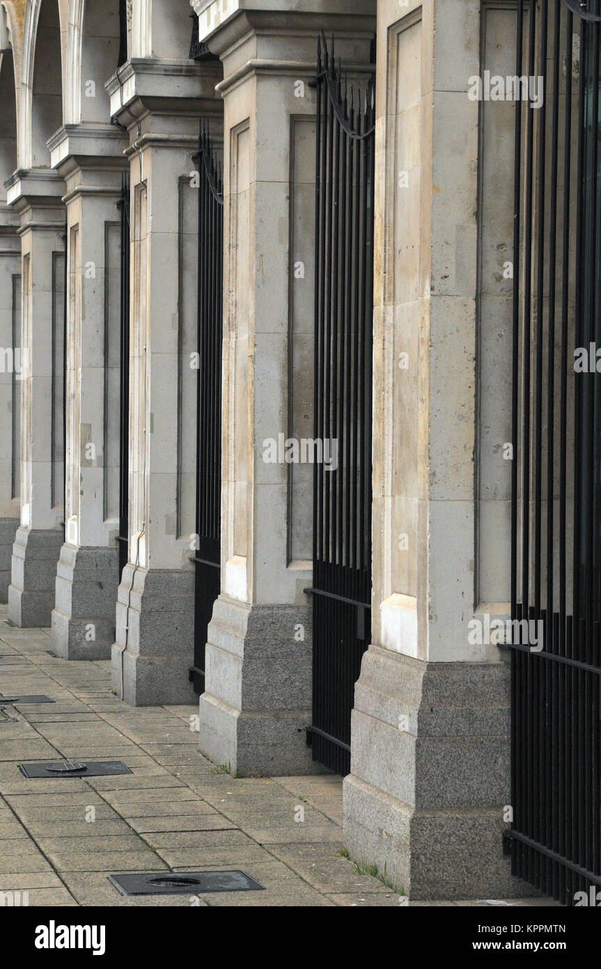 A row of stone pillars or Corinthian columns with fluted detail ...