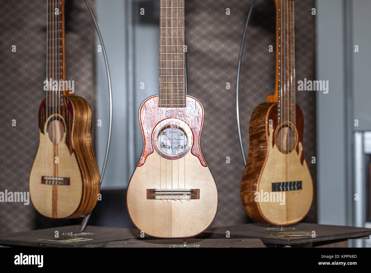 TIMPLE INSTRUMENTS for sale hanging in a music shop Stock Photo - Alamy