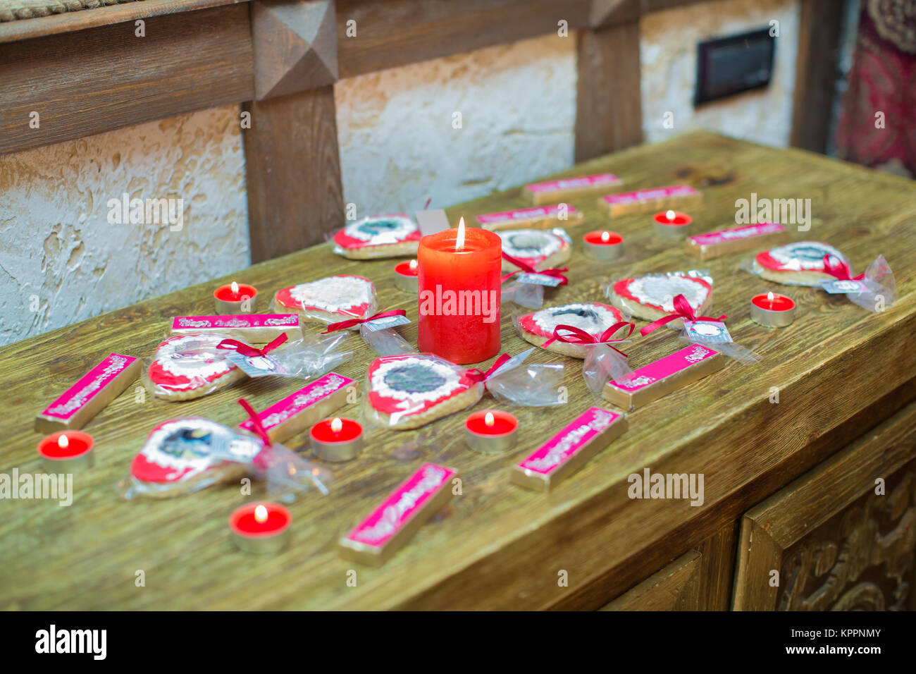 Red small and large candles. Chocolate. Candy bar Stock Photo - Alamy