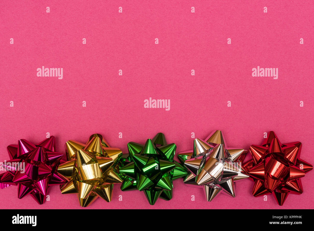 row of colored bows on a colored background Stock Photo - Alamy