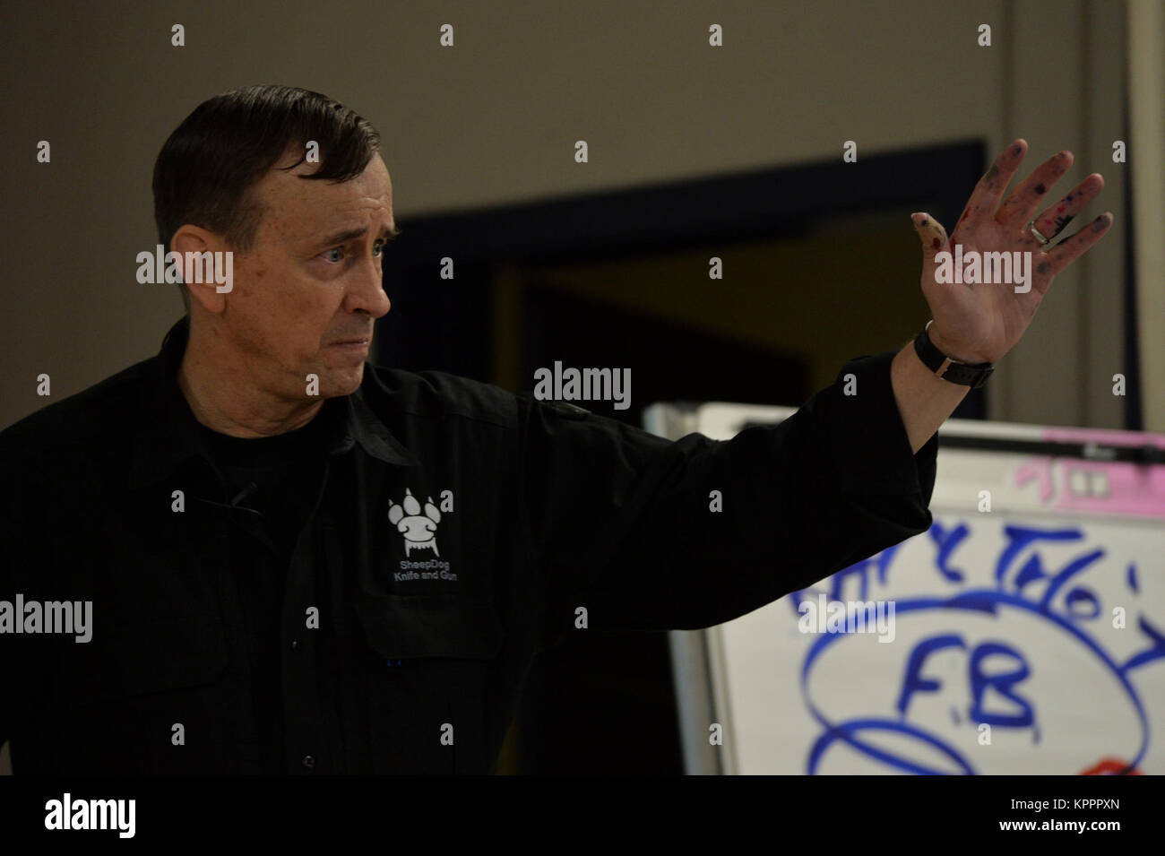 Retired Lt. Col. Dave Grossman explains to the audience some of the obstacles he and his wife ...